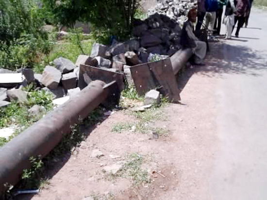 Iron poles meant for erecting gate of Buddhan model village lying on ...