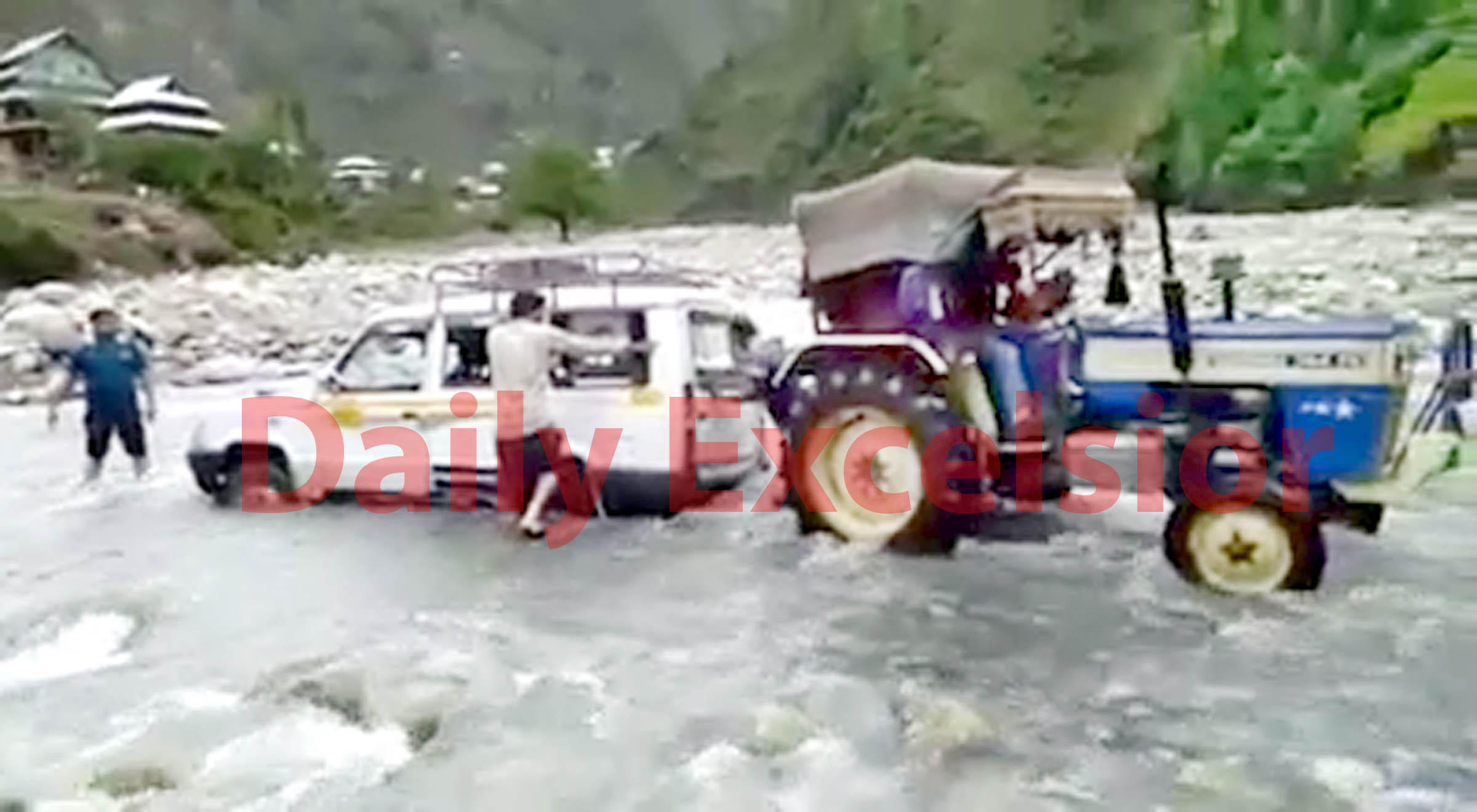 A tractor trying to pull out a Tata Sumo struck in Shadole nallah in ...