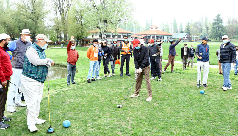 A golfer playing a shot at Royal Spring Golf Course Srinagar on Tuesday ...