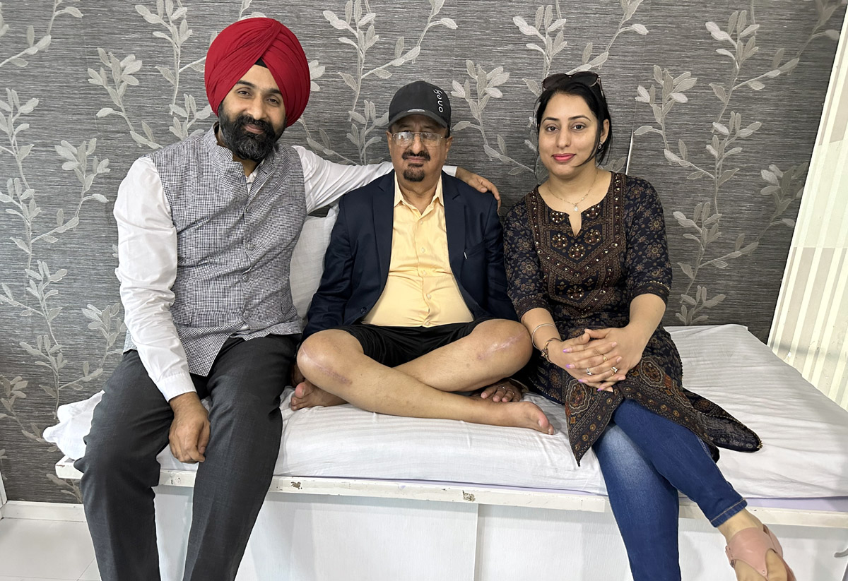 Dr Ranjit Singh posing with a patient on whom he performed knee ...